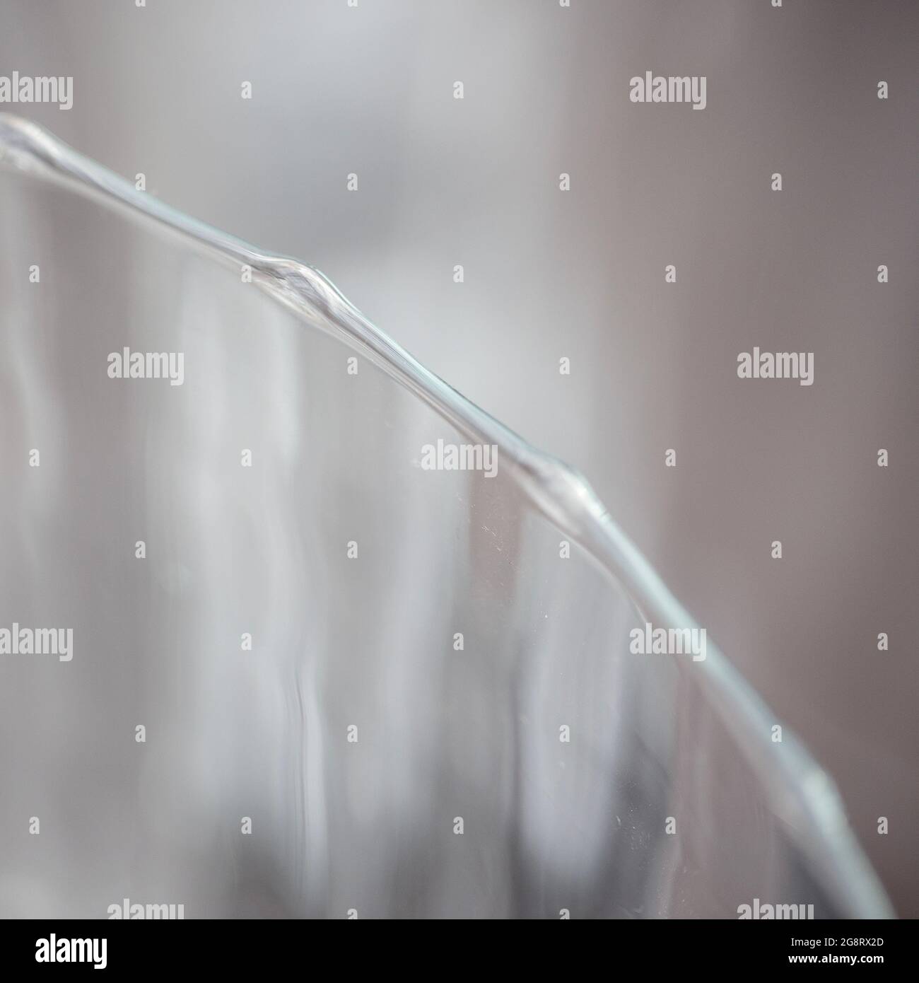 The wavy edge of a glass forms a graphic element in a square Stock ...