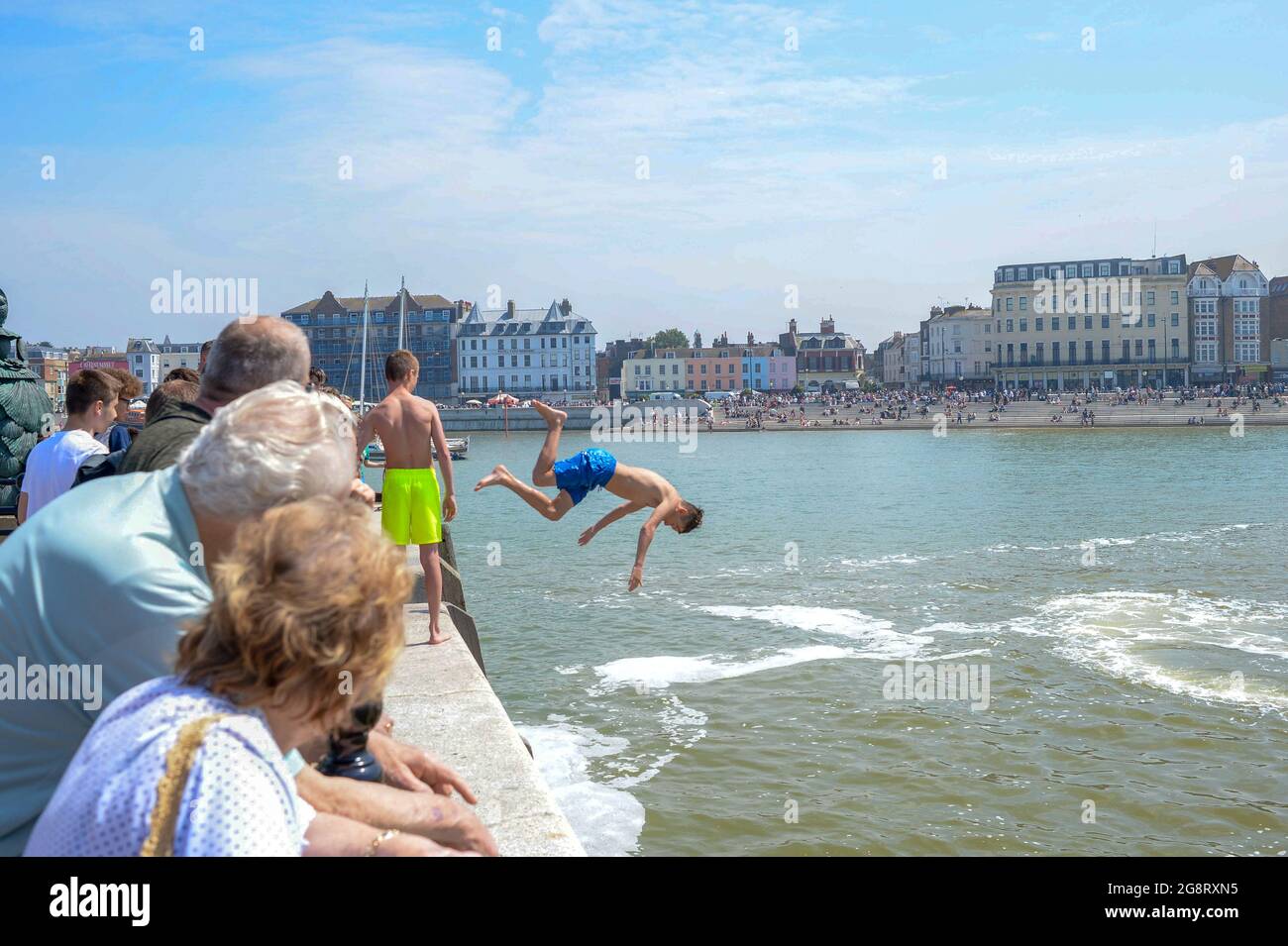 kids take huge risks diving from structures into the sea not knowing ...
