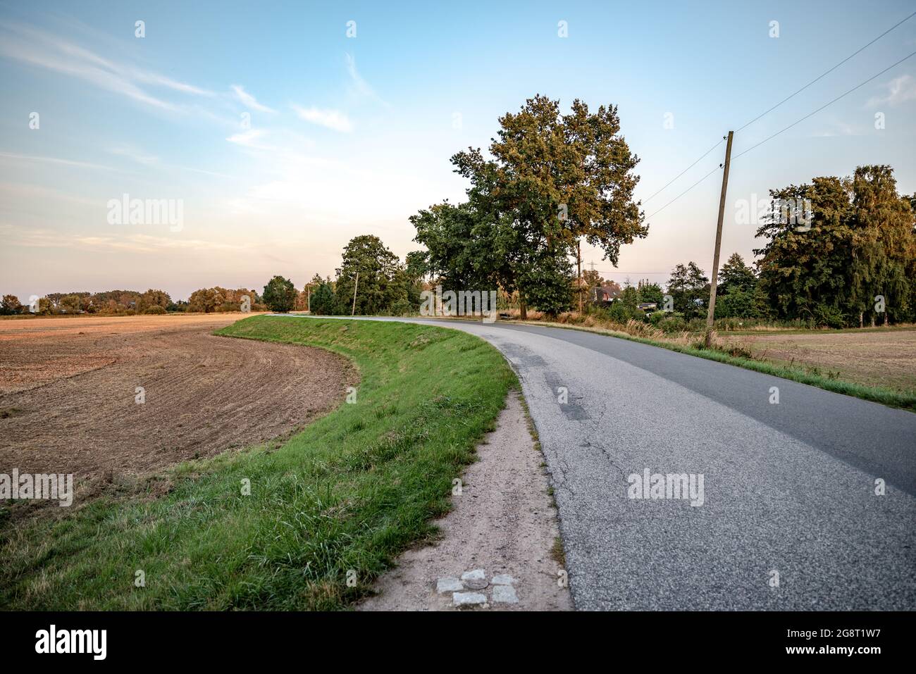 Country road curve hi-res stock photography and images - Alamy