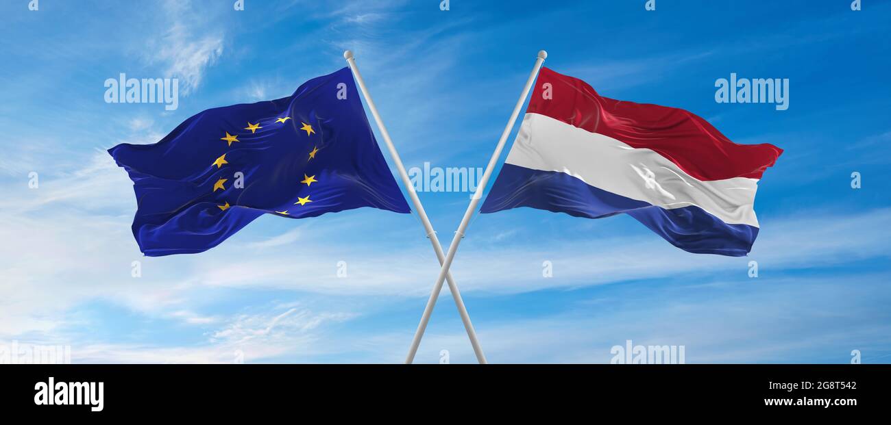 flags of European Union and netherlands waving in the wind on flagpoles ...