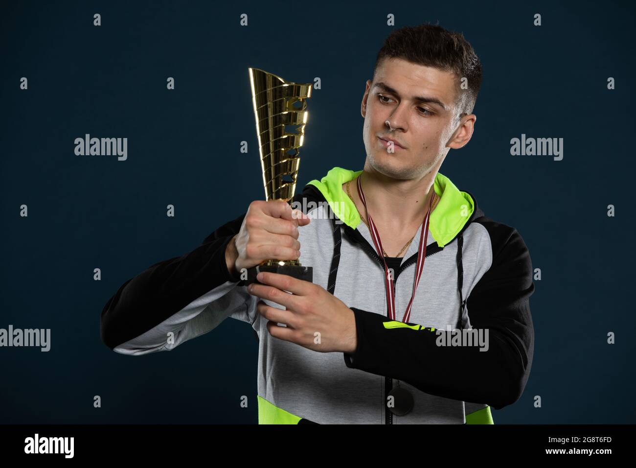 Champion cup in hands gold hi-res stock photography and images - Alamy