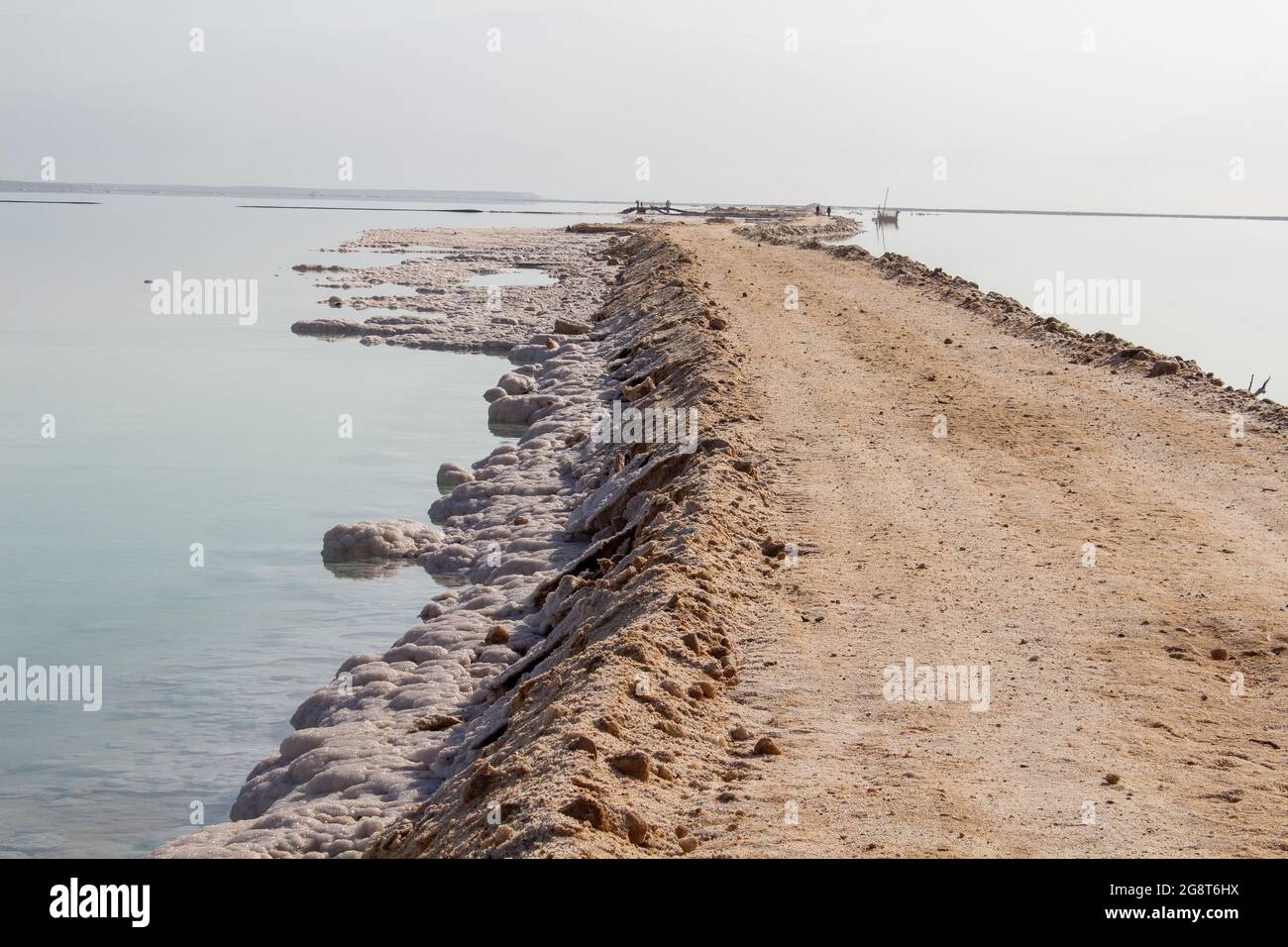 Dead Sea in Israel with salt jetty and salt beach Stock Photo - Alamy