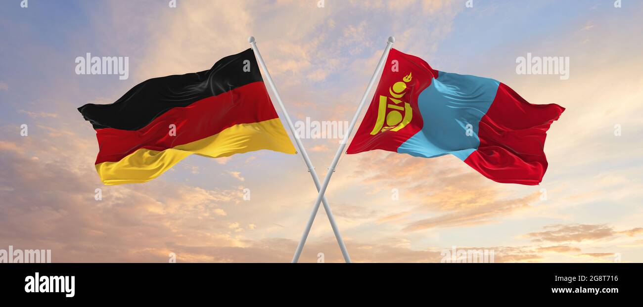 flags of Germany and Mongolia waving in the wind on flagpoles against ...