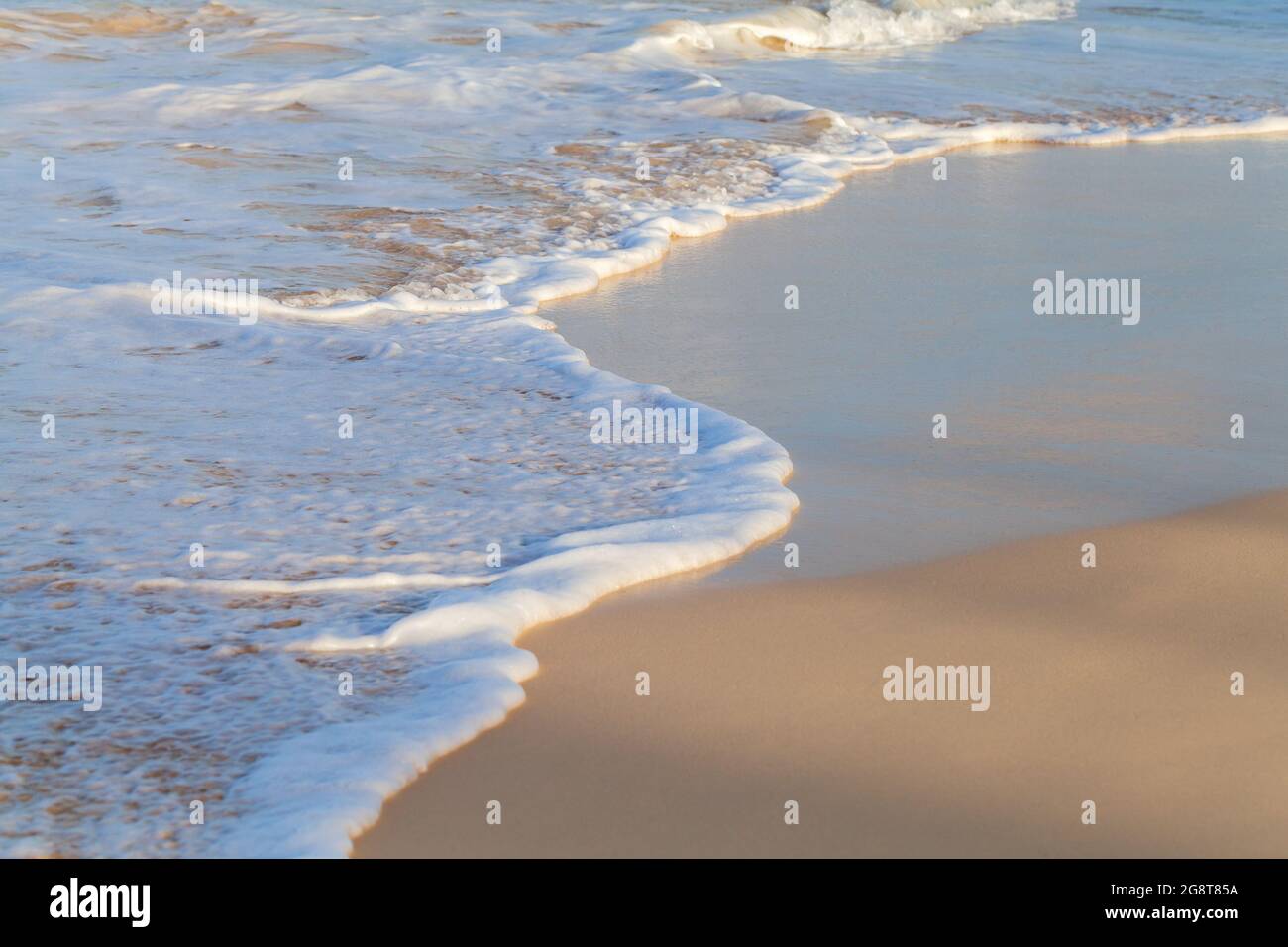 Shore water over wet sand on the beach, background photo Stock Photo ...