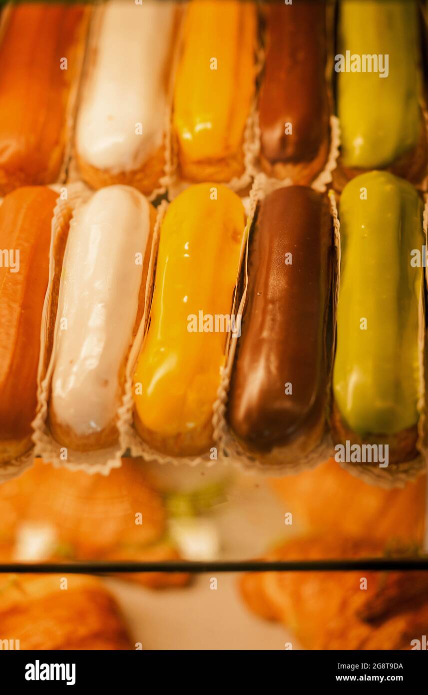 sweet and colorful eclairs on the cafe window. french eclair. top view ...