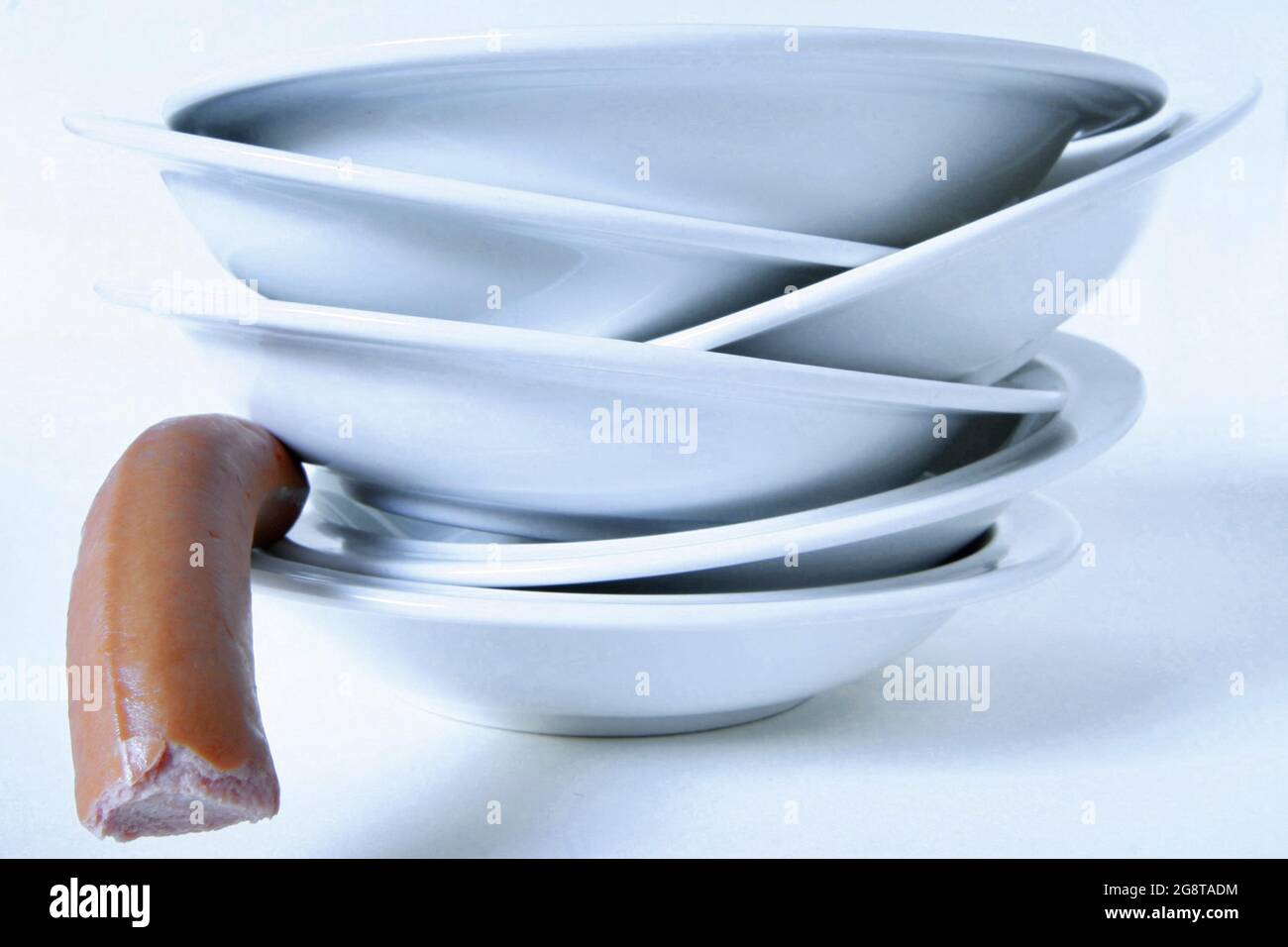 stack of dirty plates with sausage Stock Photo - Alamy