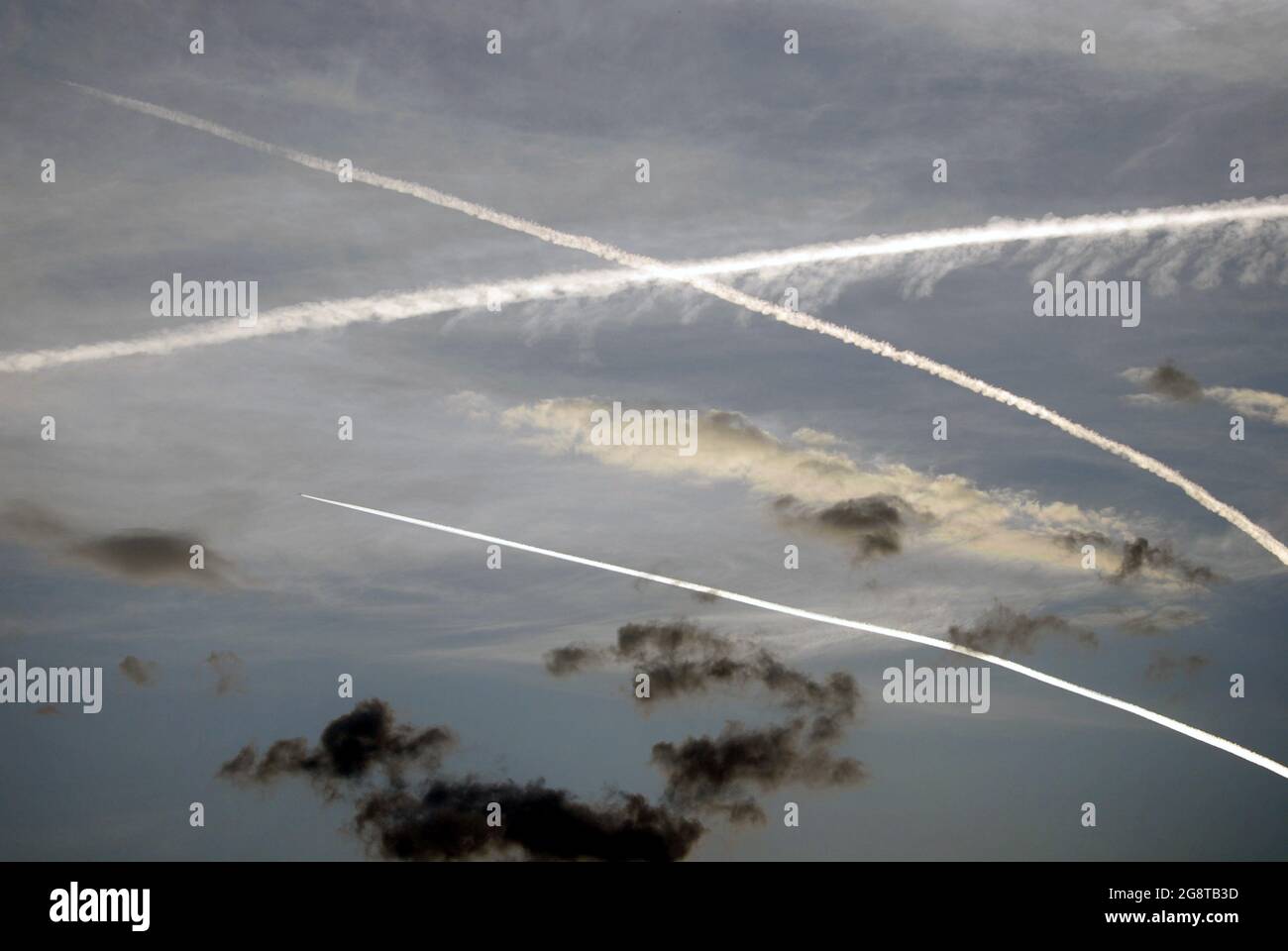 Condensation trails in the sky, Germany Stock Photo - Alamy