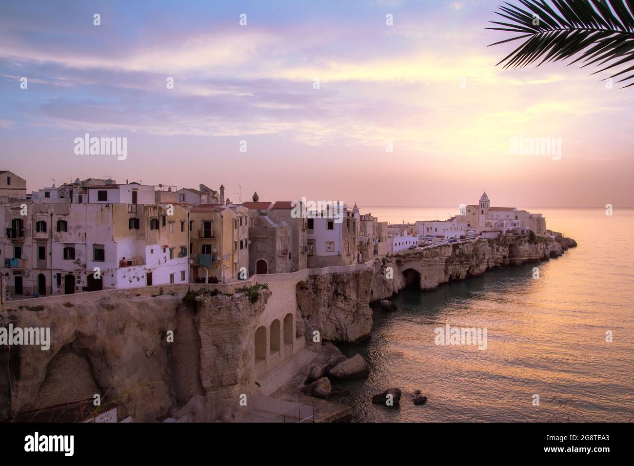 scenic sunset view over historic old town and church of San Francesco ...