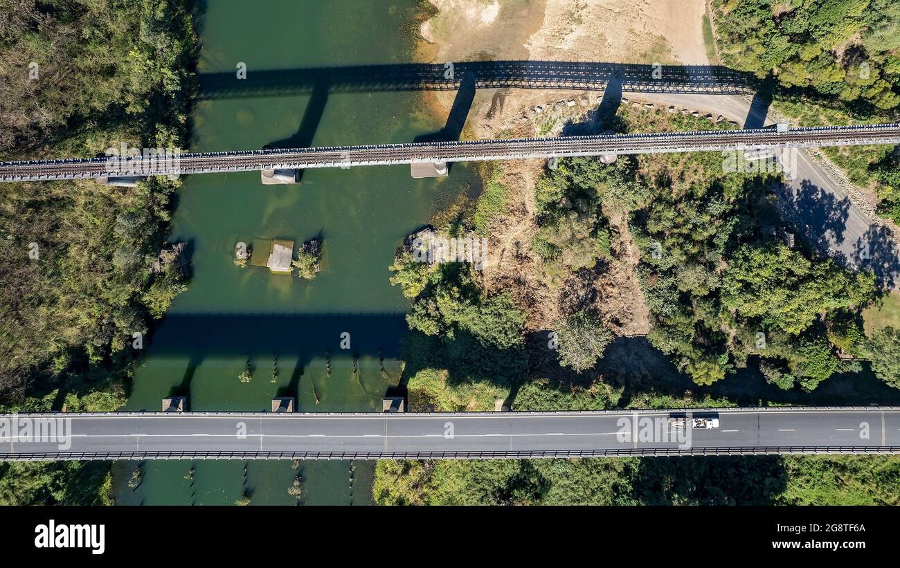 Aerial pattern landscape looking down onto road and rail bridges with ...