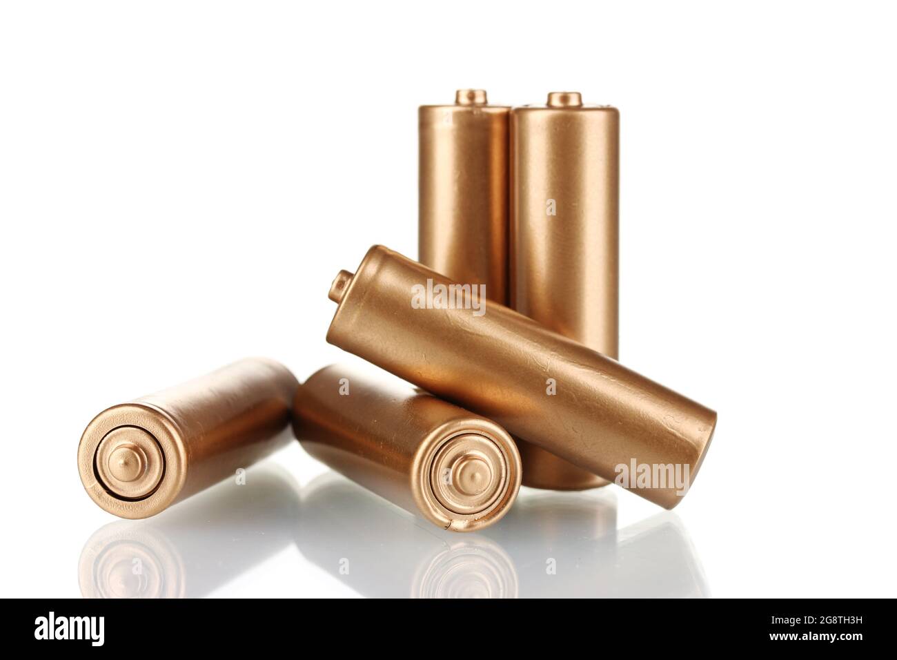 golden batteries isolated on white Stock Photo - Alamy