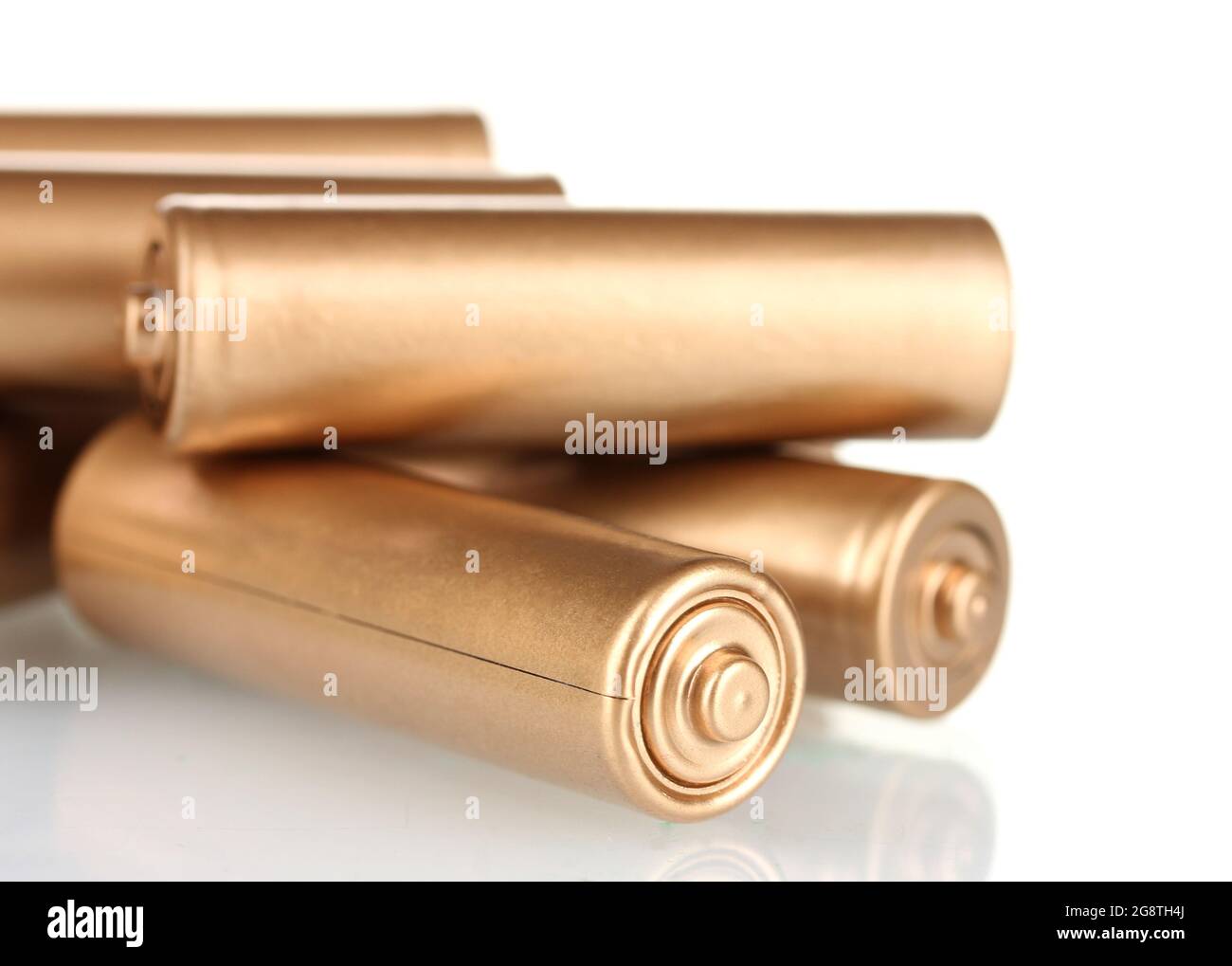 golden batteries isolated on white Stock Photo - Alamy