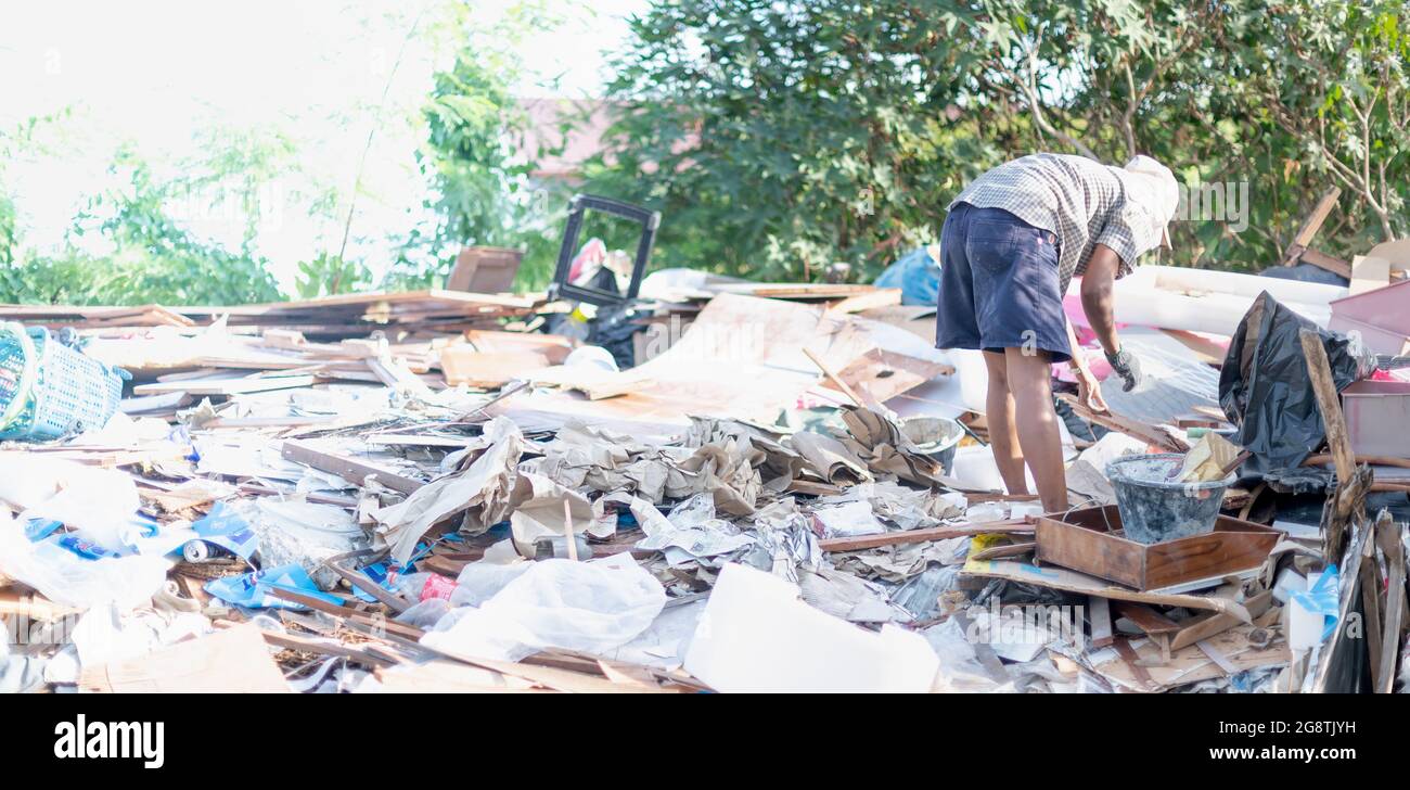 Workers are working in garbage carton box management with health risks ...