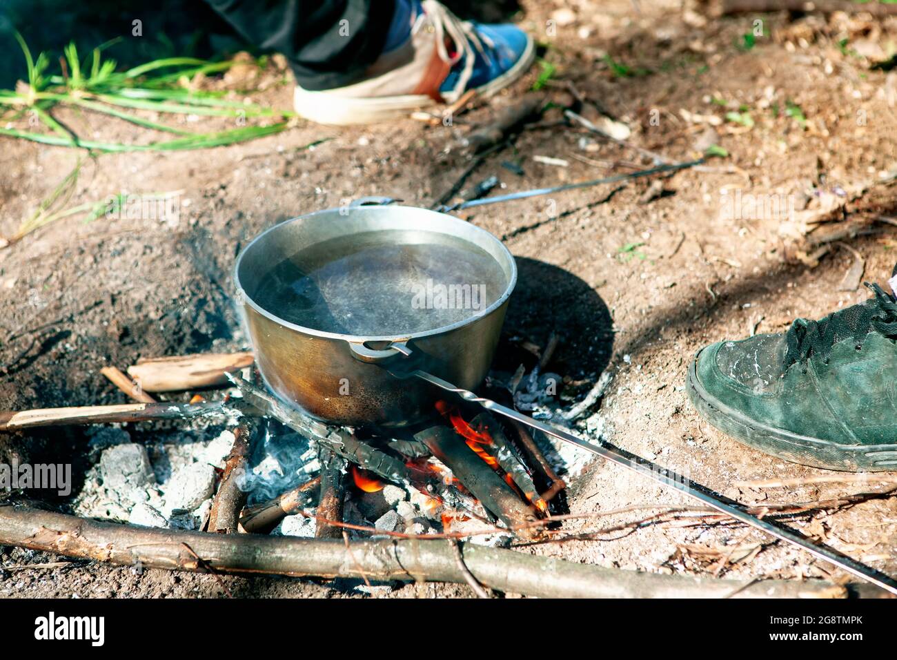 Cauldron on campfire . Picnic in vacation . Boiling water Stock Photo ...