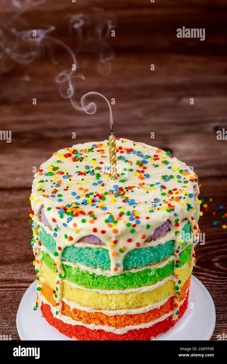 Birthday cake with blow out candle and smoke. Close up Stock Photo - Alamy