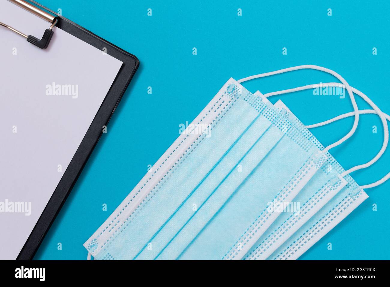 Blue medical masks on table hi-res stock photography and images - Alamy