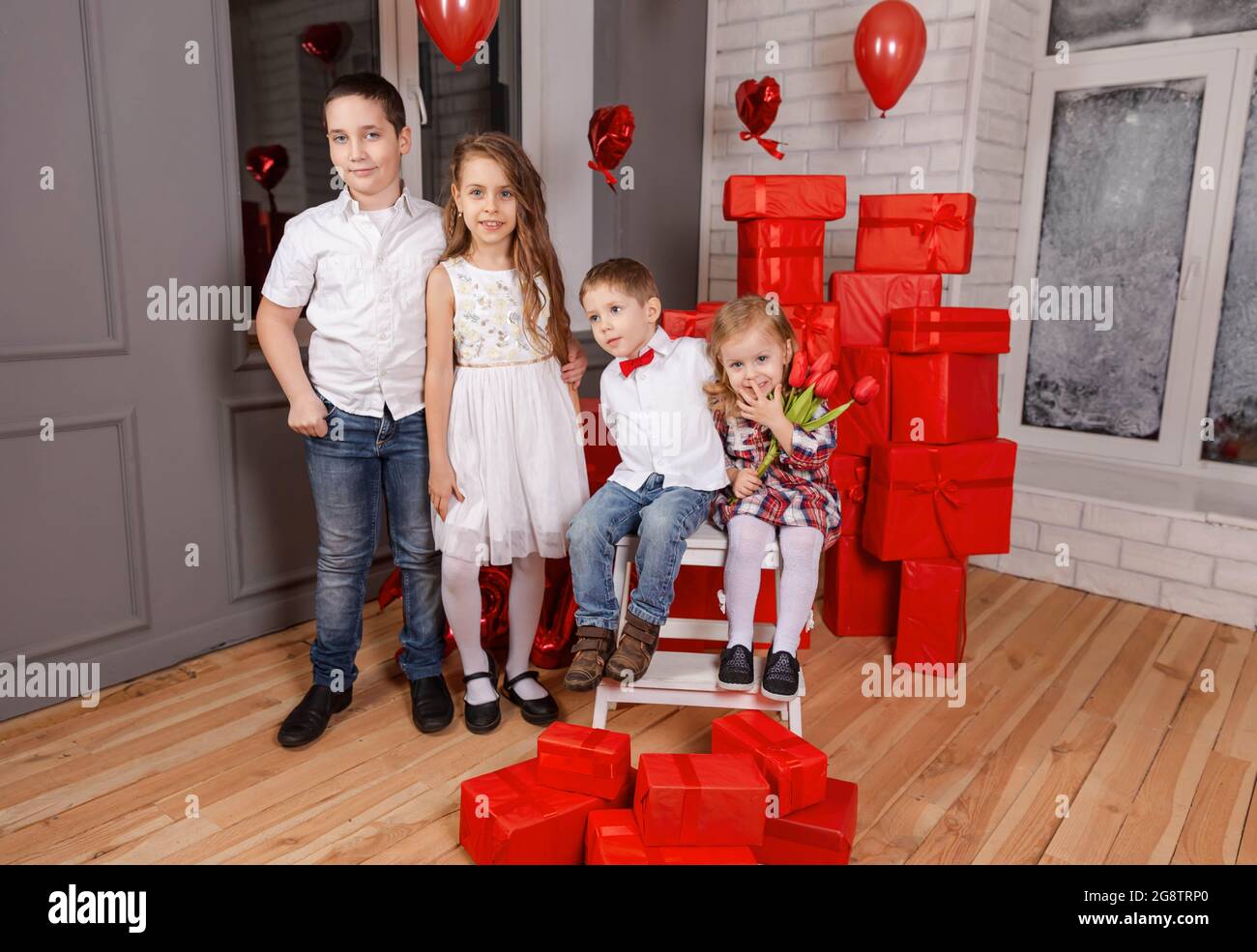 Four cute kids. Portrait of happy kids looking at camera Stock Photo ...
