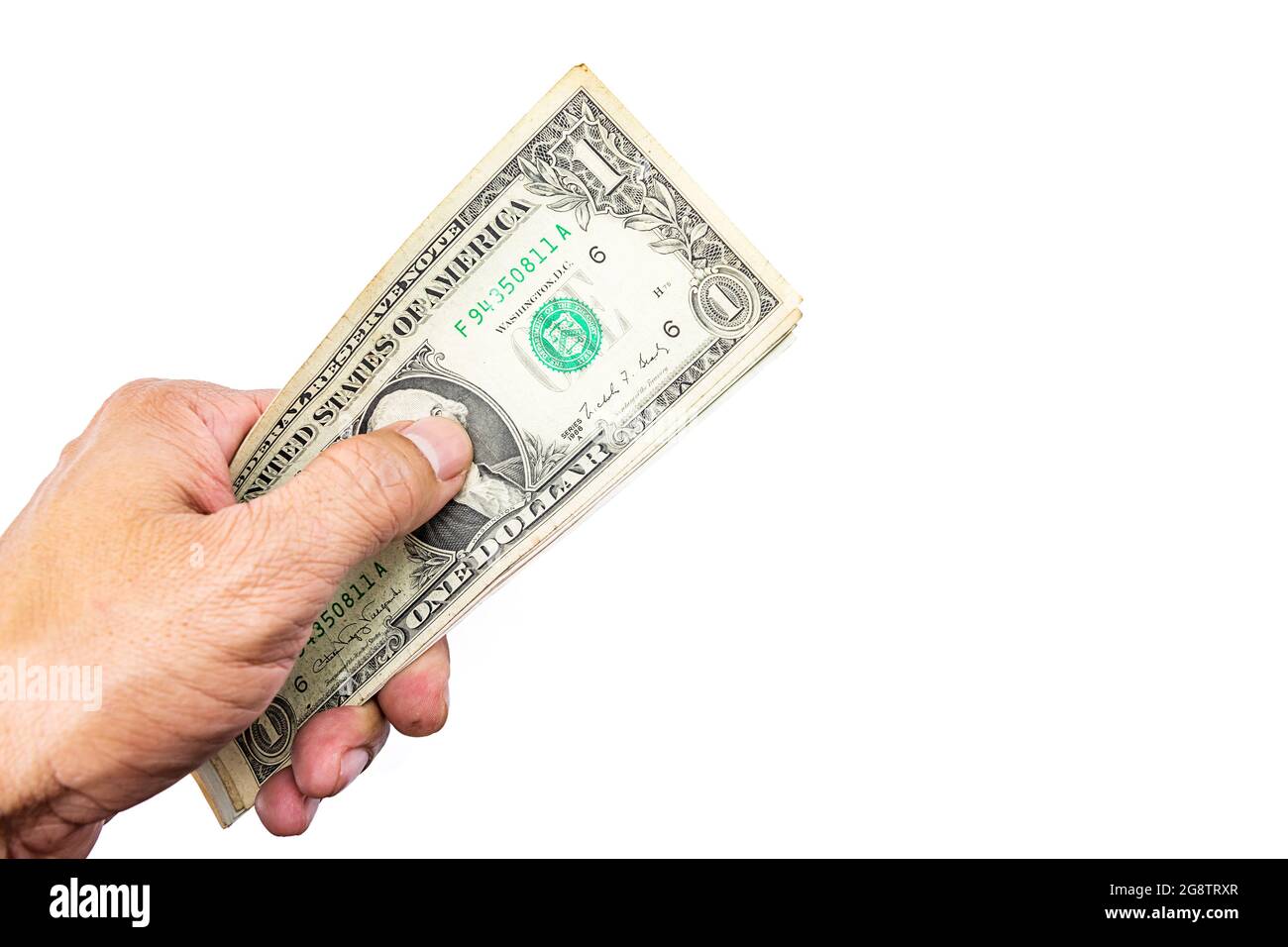 Cash US dollars on hand, isolated on white Stock Photo - Alamy