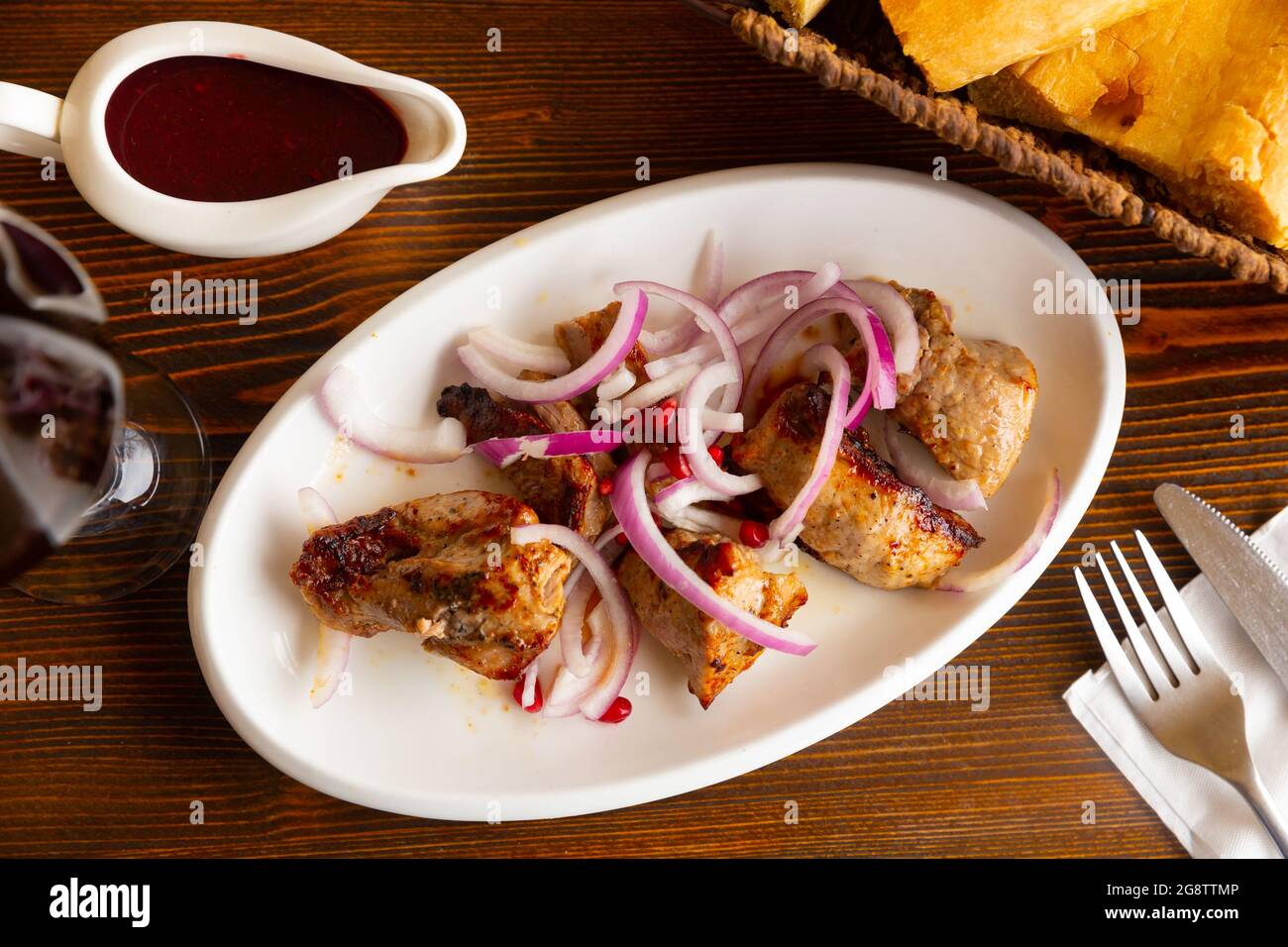 Grilled pork meat shashlik with sliced onion Stock Photo - Alamy
