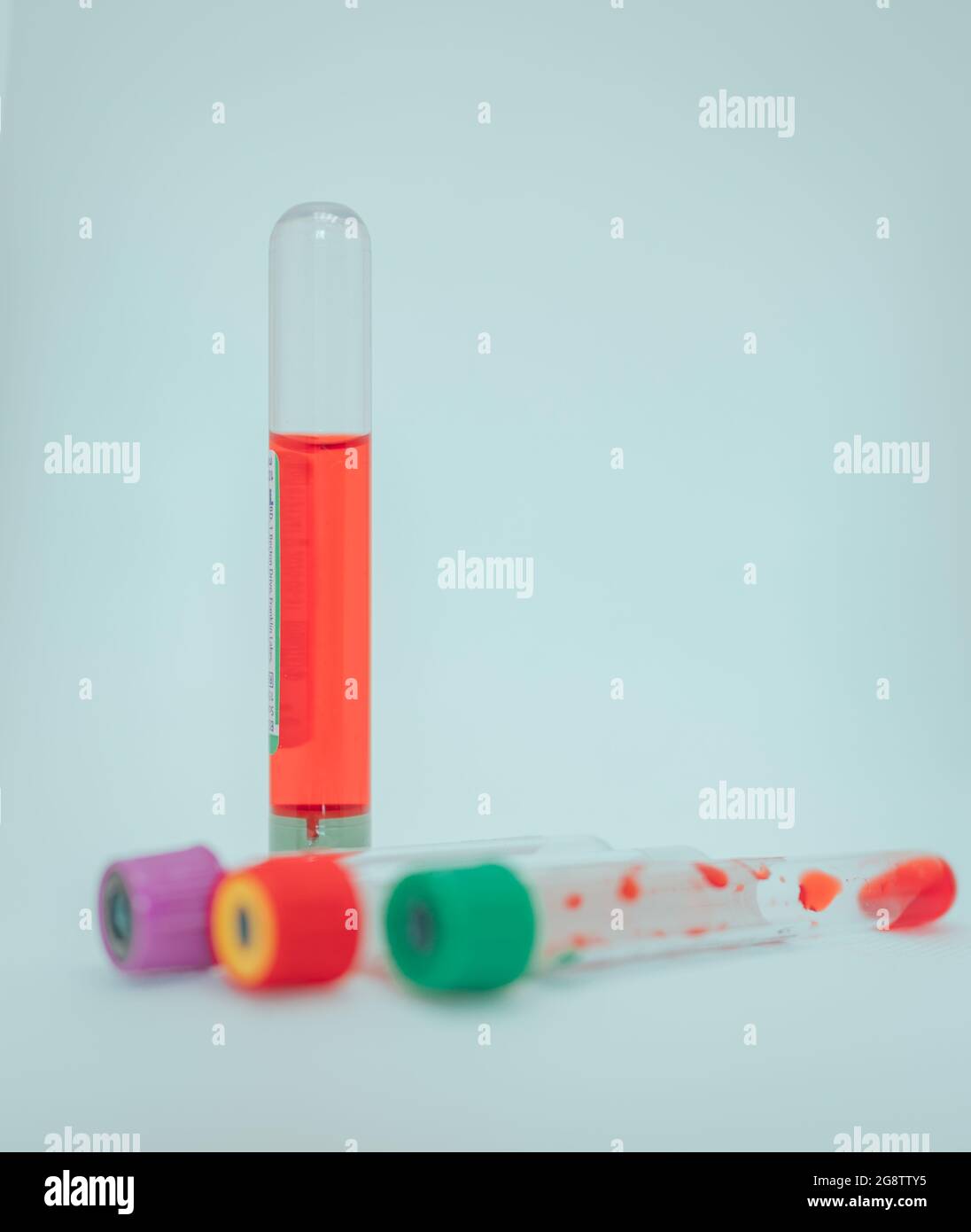 Closeup of test tubes with blood sample isolated on a white background ...