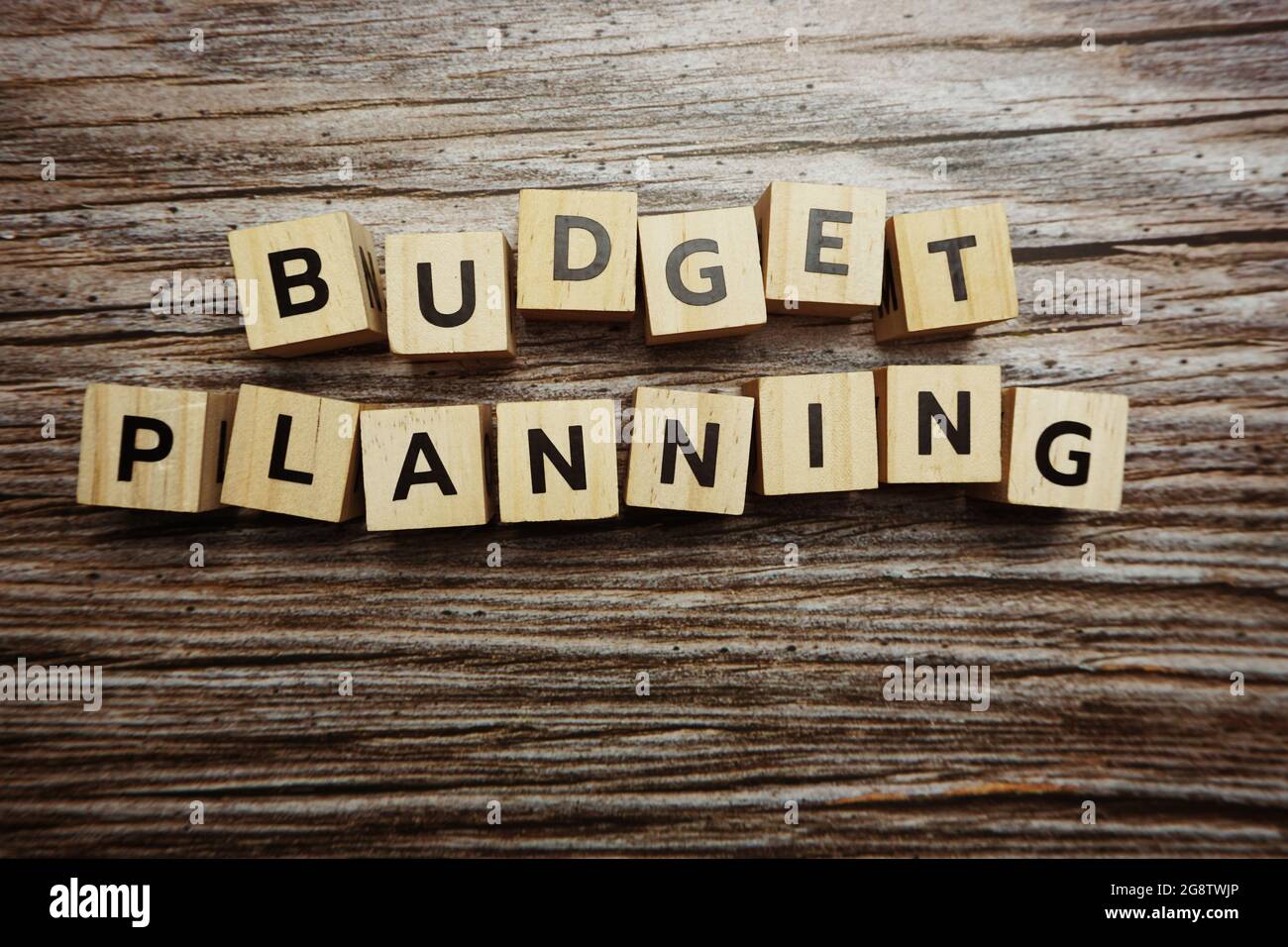 Budget Planning alphabet letters on wooden background Stock Photo - Alamy