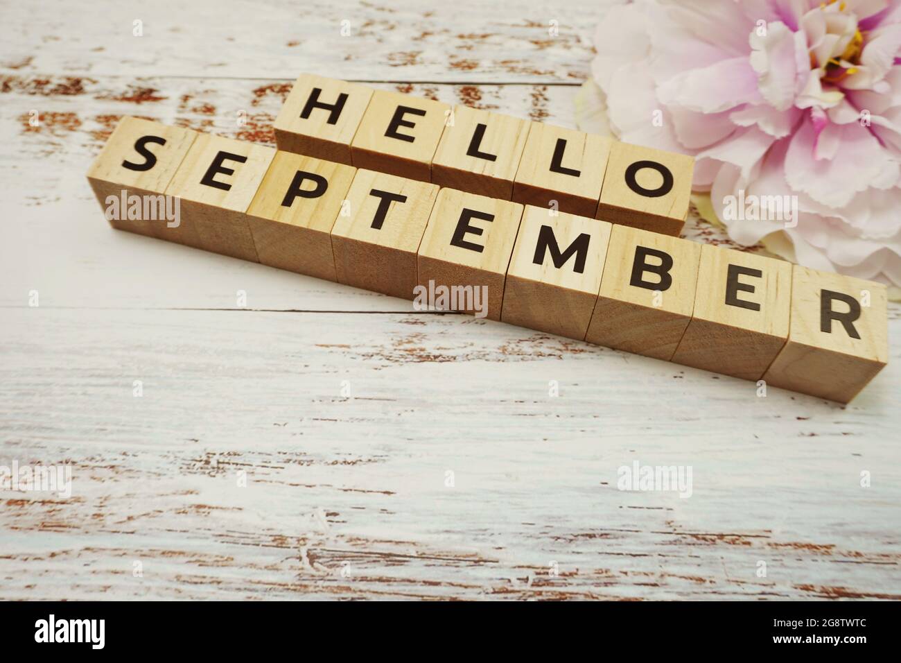Hello September alphabet letters on wooden background Stock Photo - Alamy
