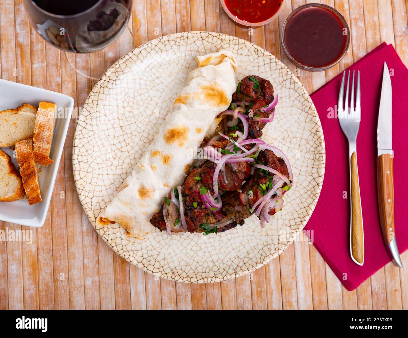 Grilled pork meat shashlik with sliced onion Stock Photo - Alamy