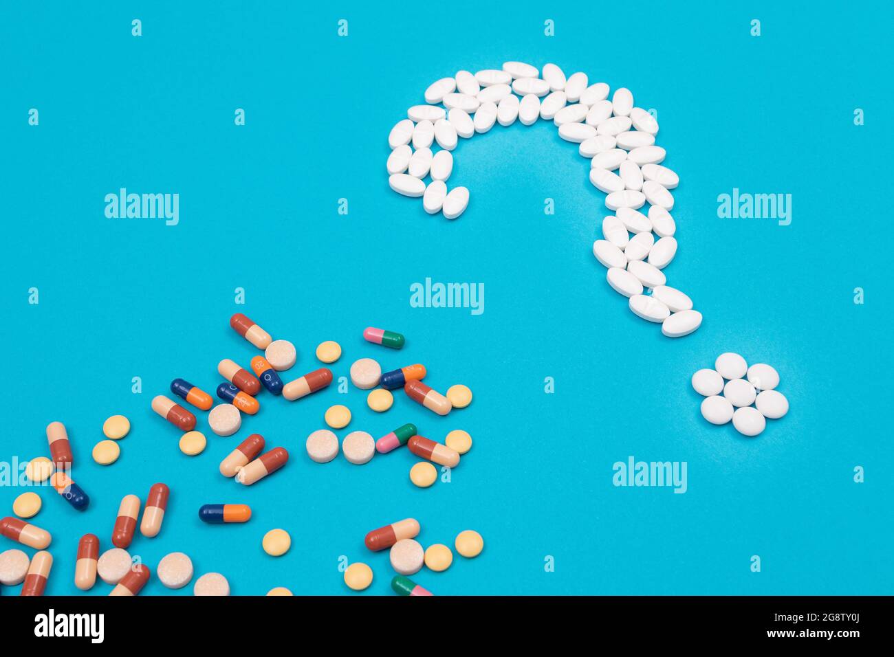 Question Mark Made from White Pills and Tablets with Colored Capsules ...