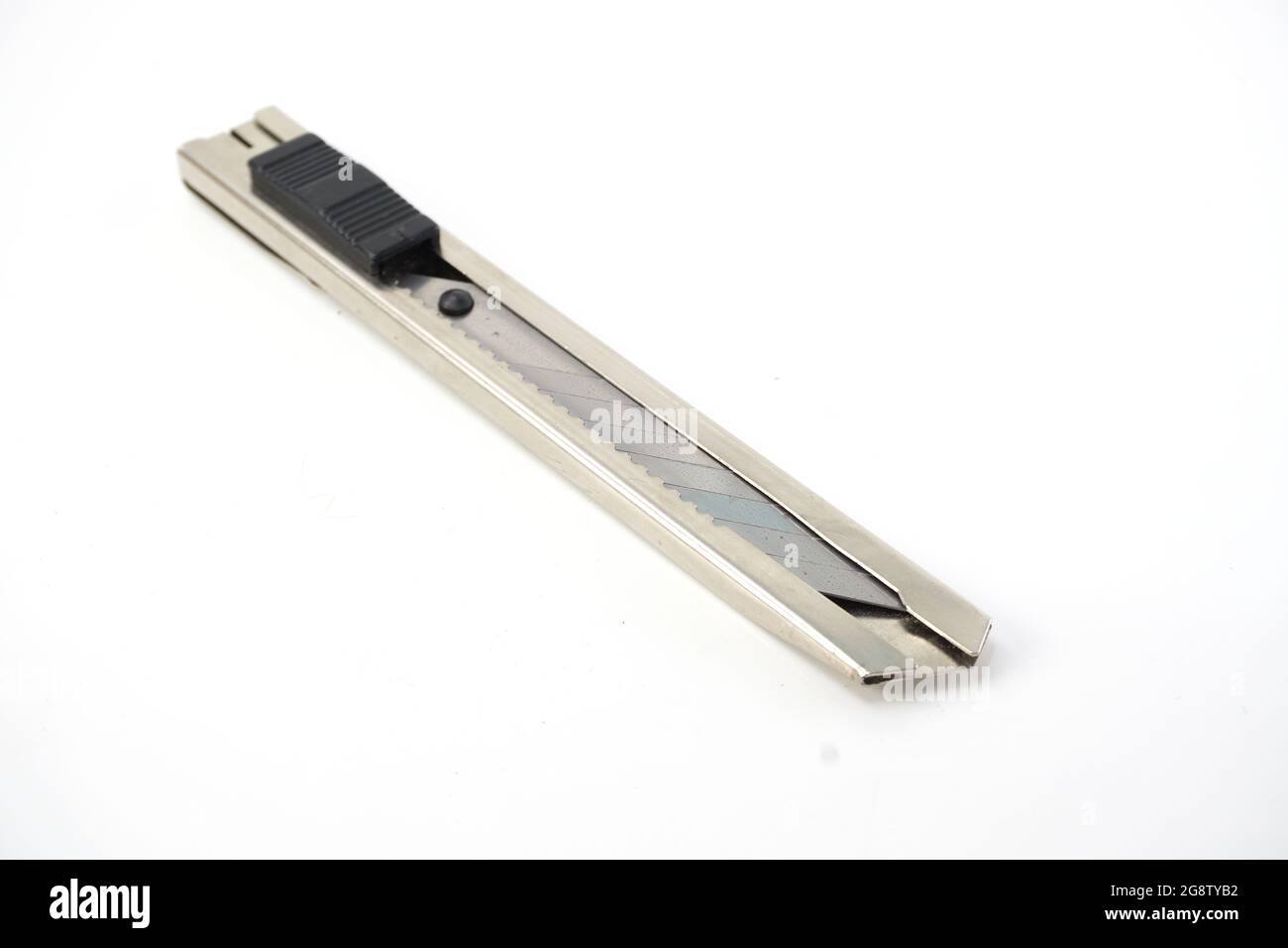 Cutter knife isolated on white background Stock Photo - Alamy