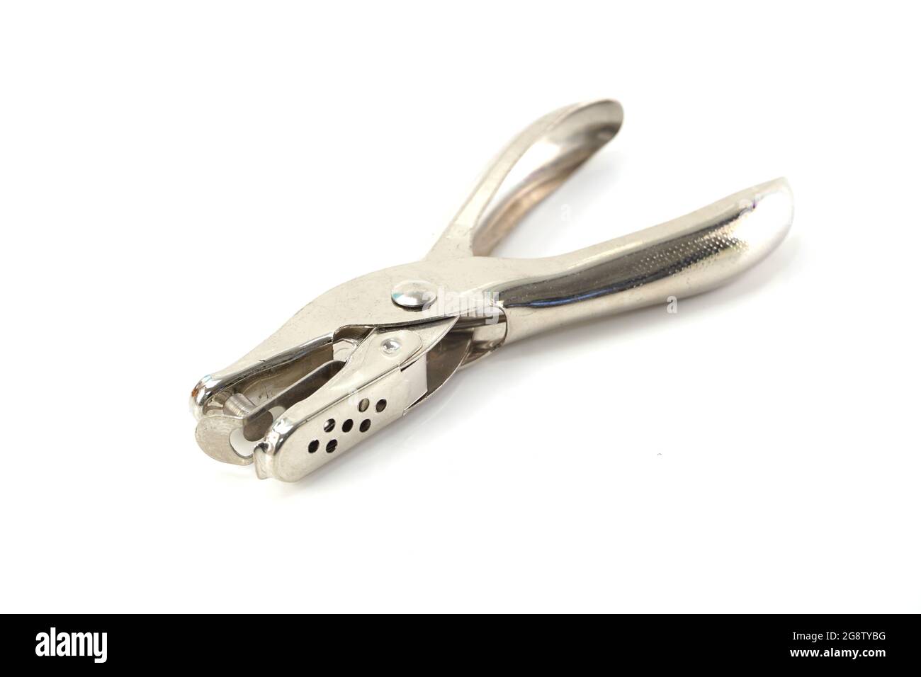 metal paper punch isolated on white background Stock Photo - Alamy