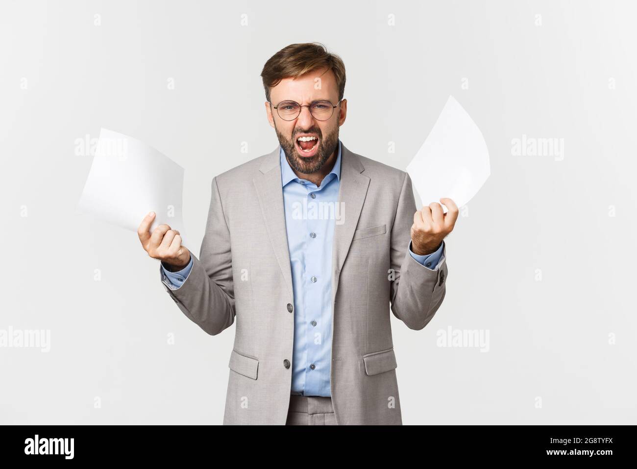 Portrait of angry businessman in grey suit and glasses, disappointed ...