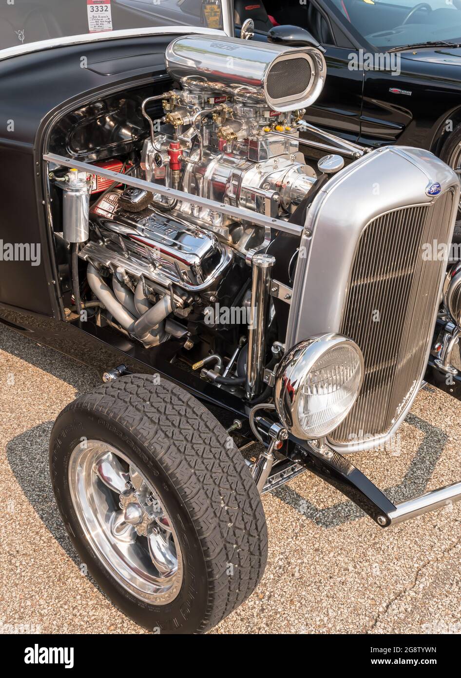 A modified high performance engine on a vintage Ford automobile at a ...