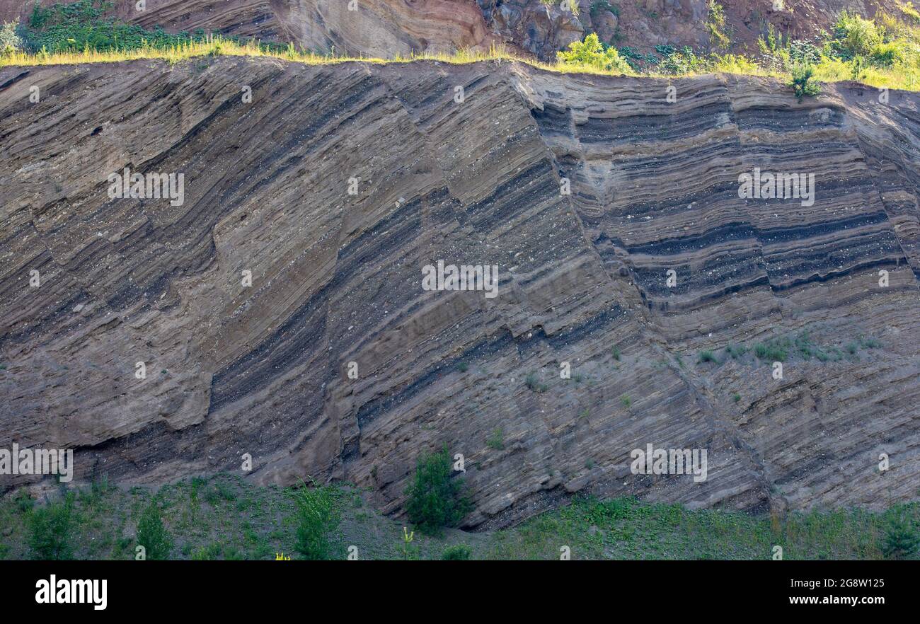 Closeup of different layers of rock in a rocky wall Stock Photo - Alamy