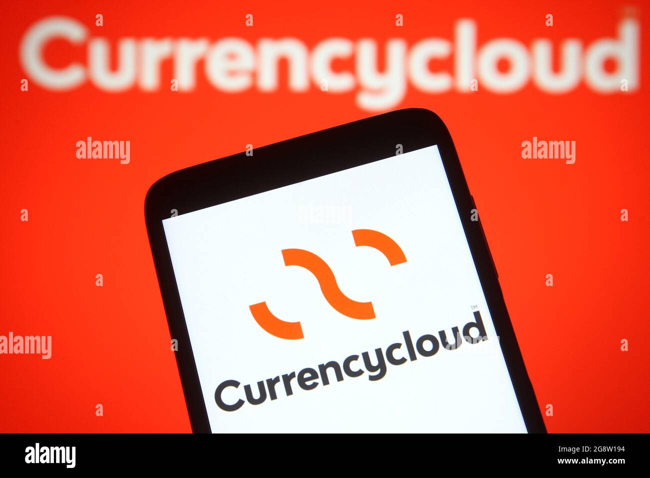 In this photo illustration a Currencycloud logo is seen on a smartphone ...