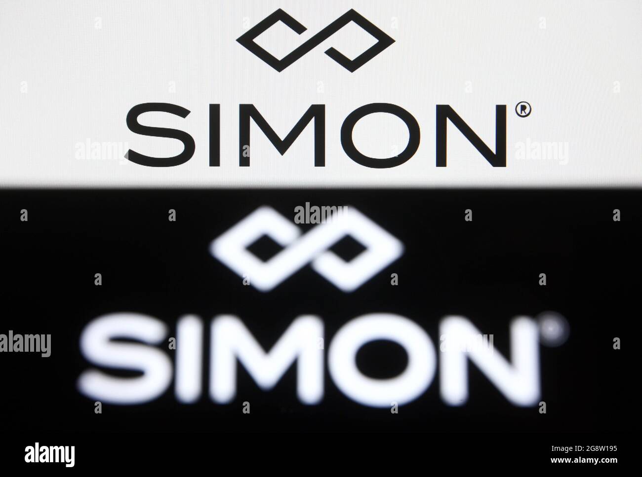 In this photo illustration a Simon Property Group logo of a real estate ...