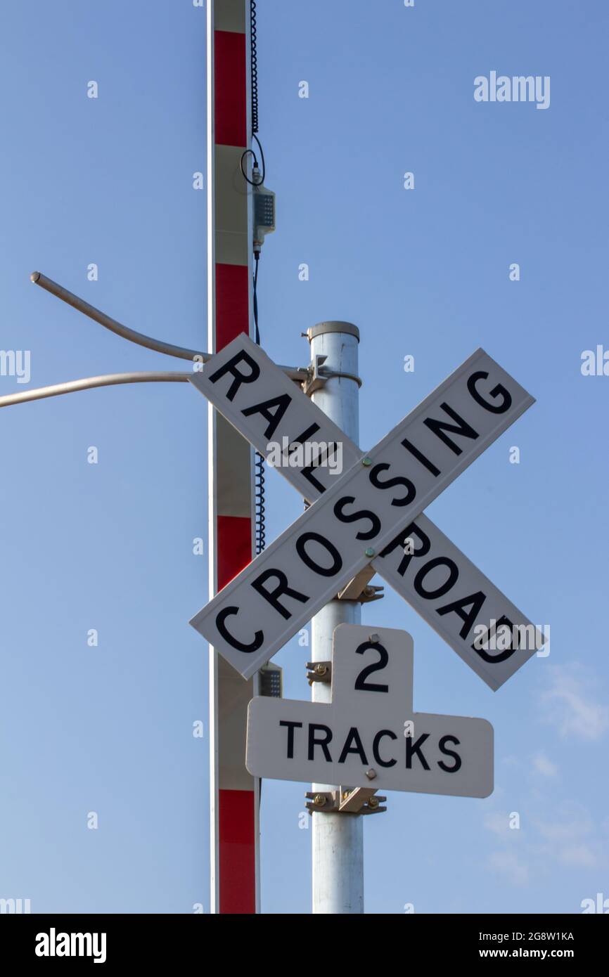 Close-up view of railroad crossing sign indicating two tracks, in a ...