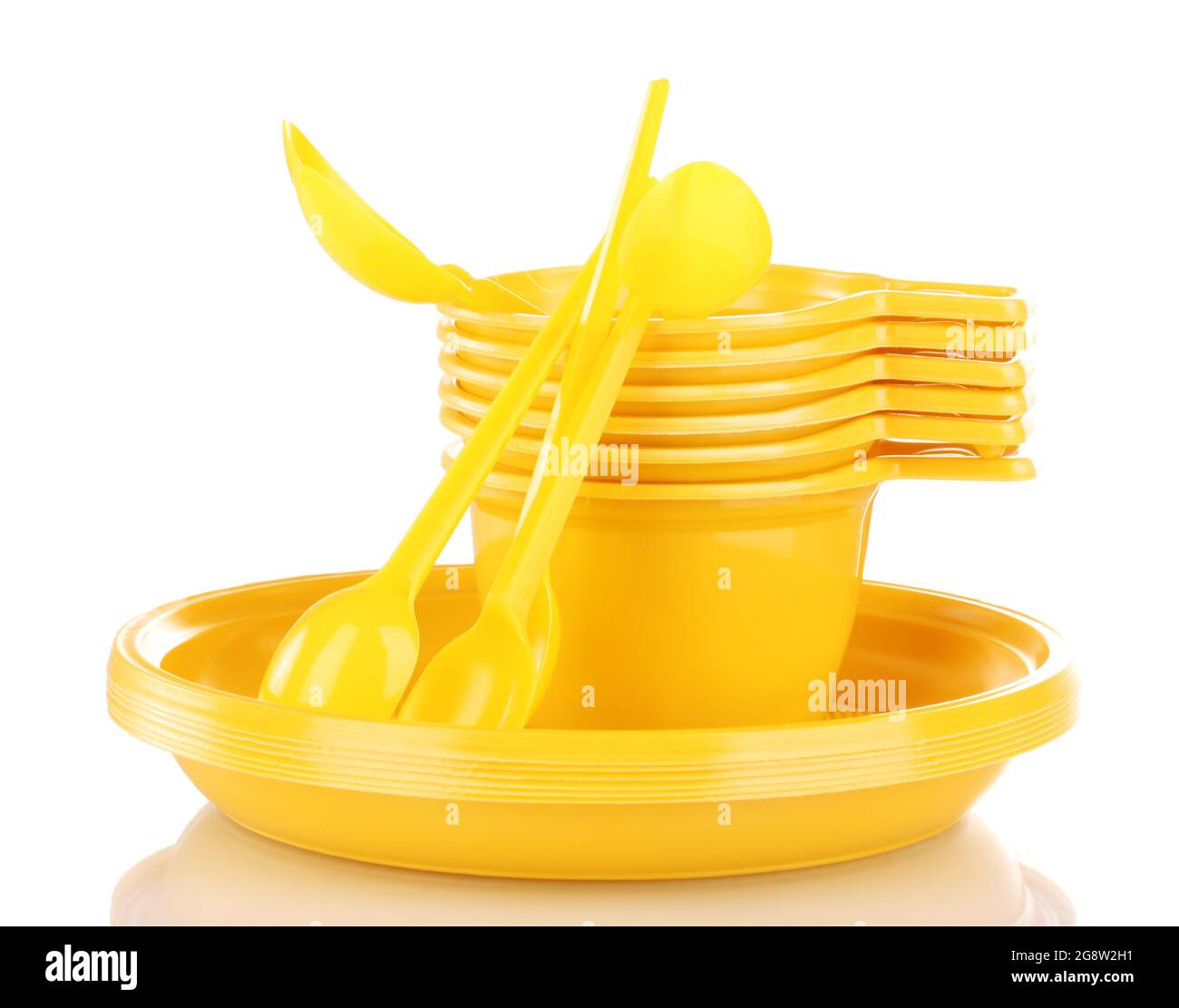 Bright yellow plastic tableware isolated on white Stock Photo - Alamy