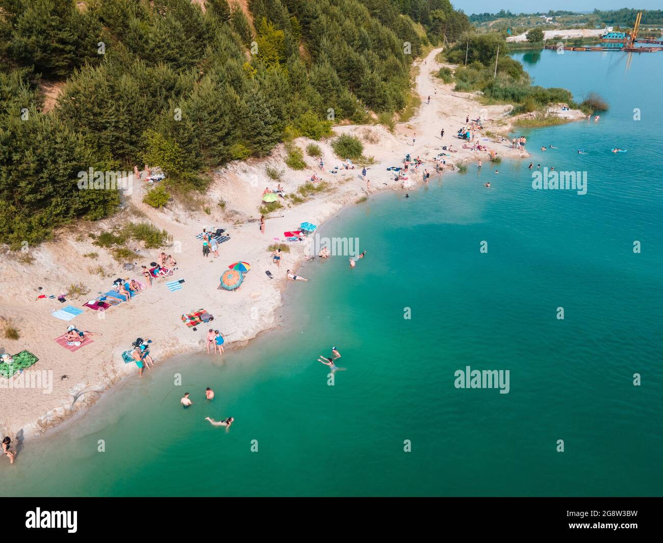 aerial view of people swimming in blue azure water sunbathing resting ...