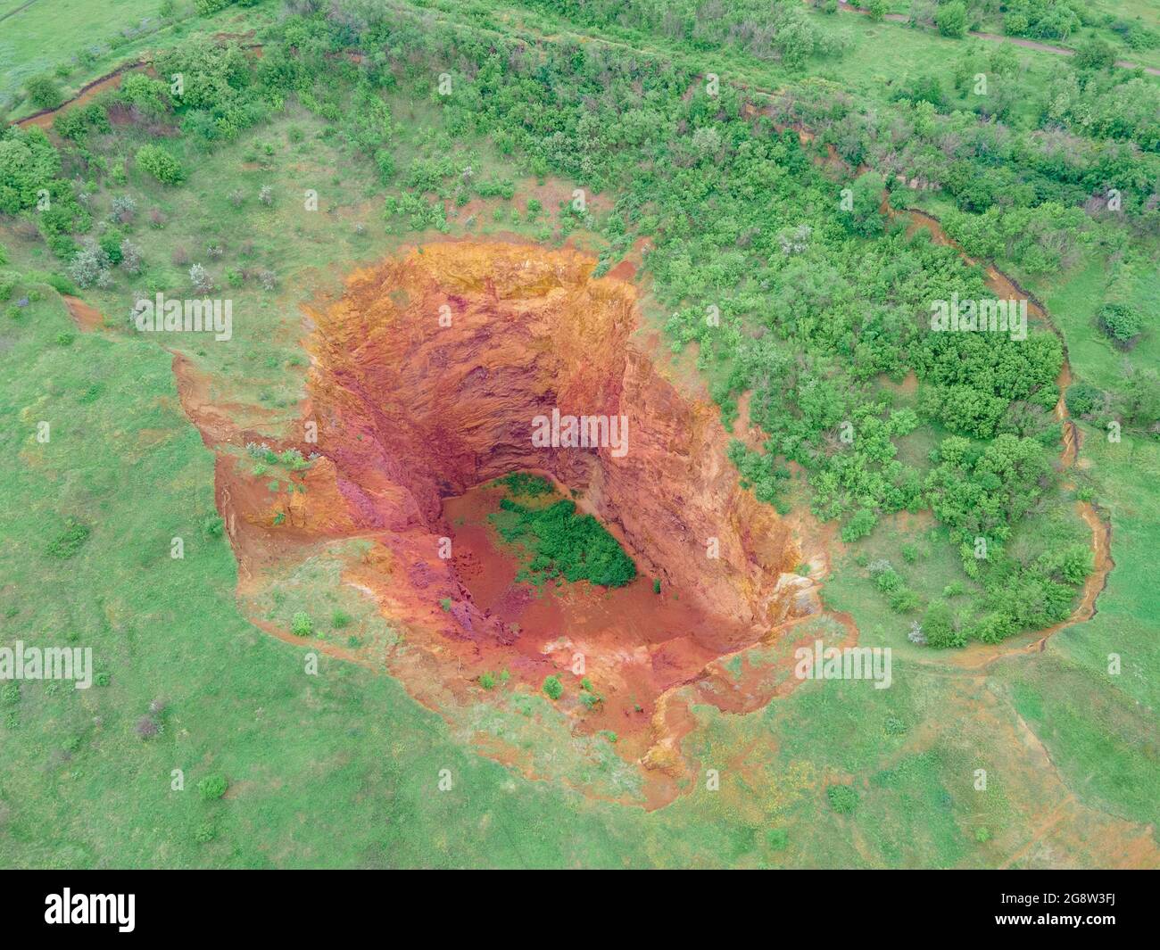 overhead view of collapsed mine big hole in land Stock Photo - Alamy