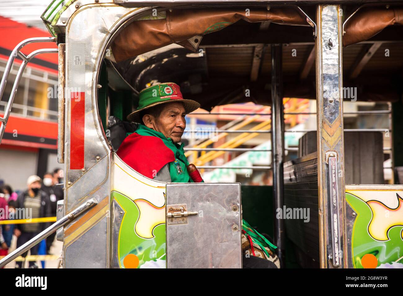 A member of the indigenous guard sits in a traditional bus during the ...