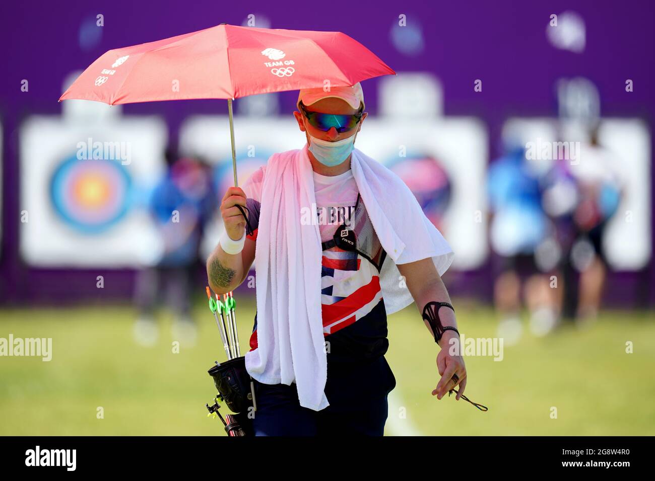 Great Britain's Patrick Huston shields from the sun during the Men's ...