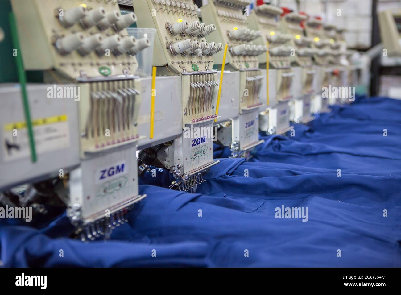 sewing machines on going Stock Photo - Alamy