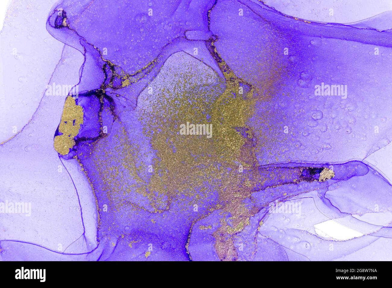Abstract alcohol ink violet background with pile of gold glitter in the ...