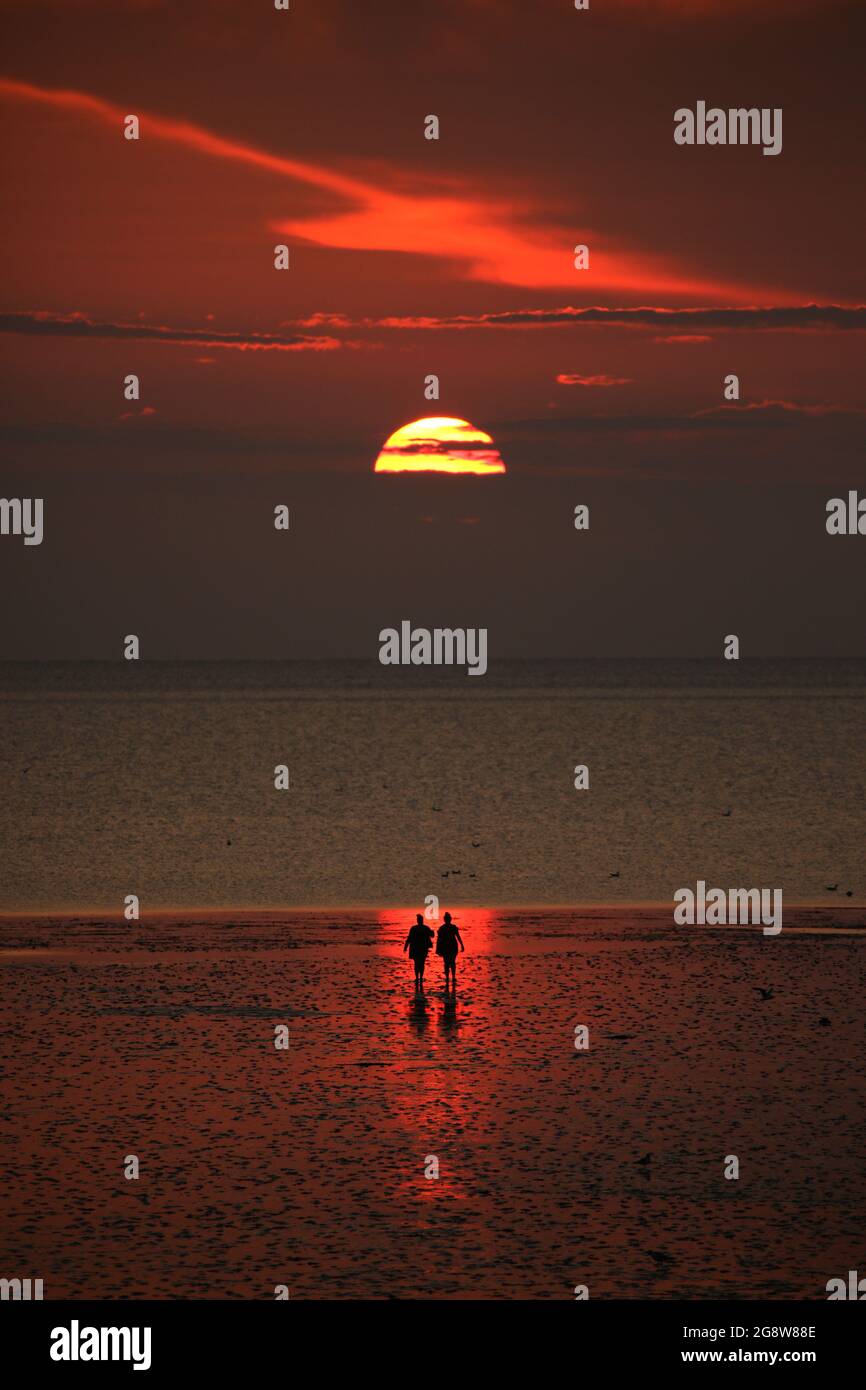 Heacham, UK. 21st July, 2021. People out for a walk on another ...
