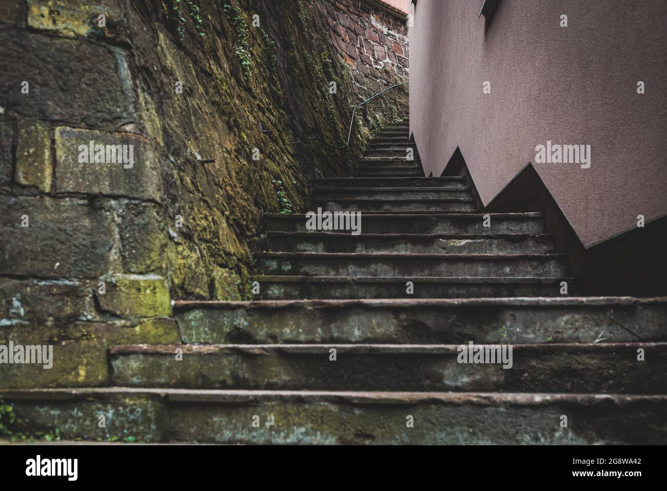 stone stairs between the building and the old wall, old town ...