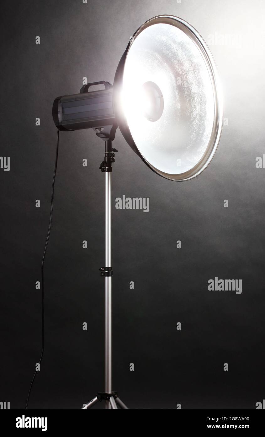 Studio flash on grey background Stock Photo - Alamy