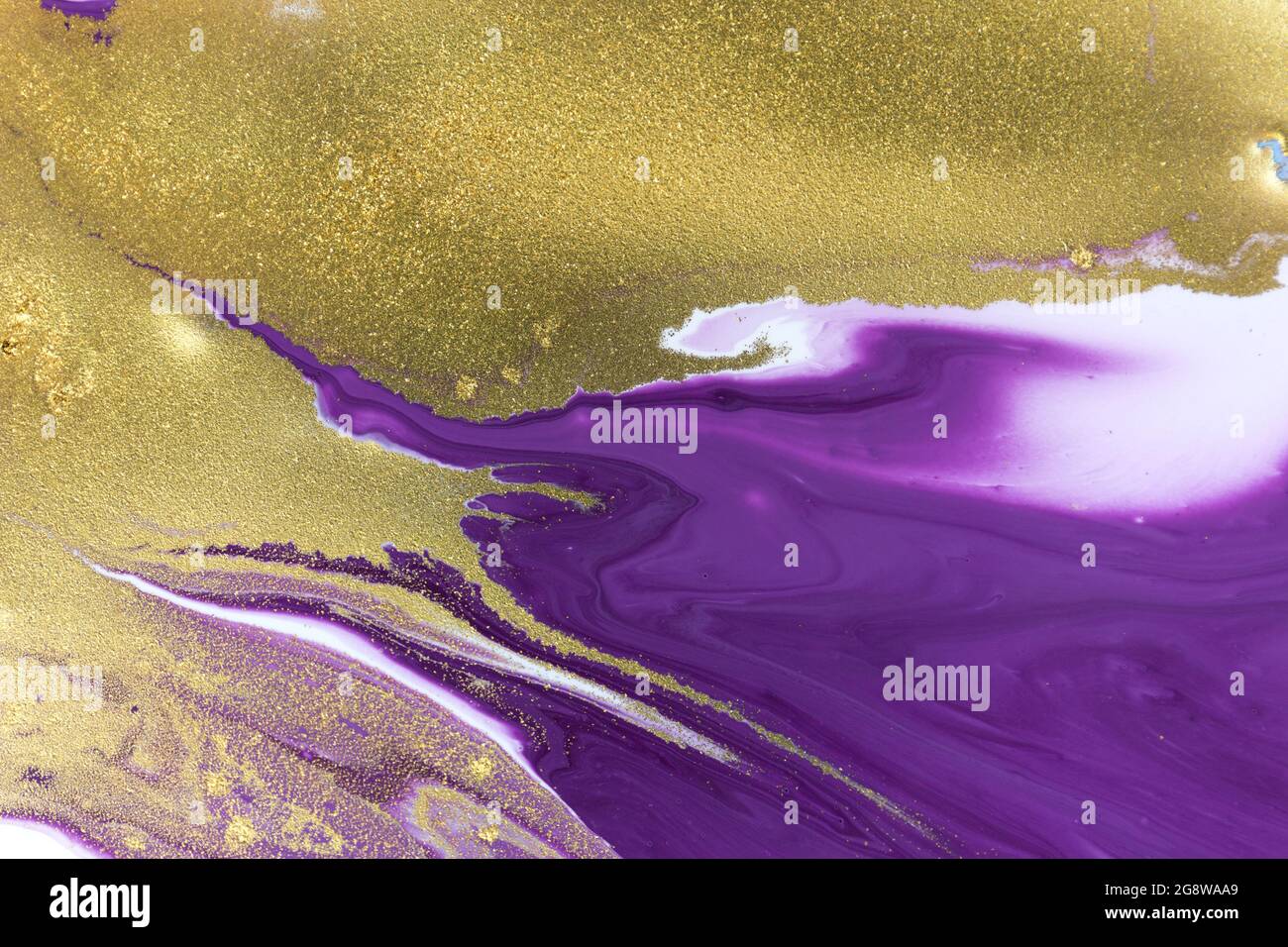 Gold dust on violet liquid acrylic artwork background Stock Photo - Alamy