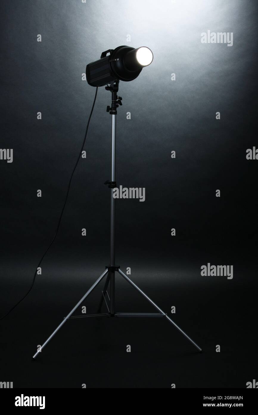 Studio flash on grey background Stock Photo - Alamy