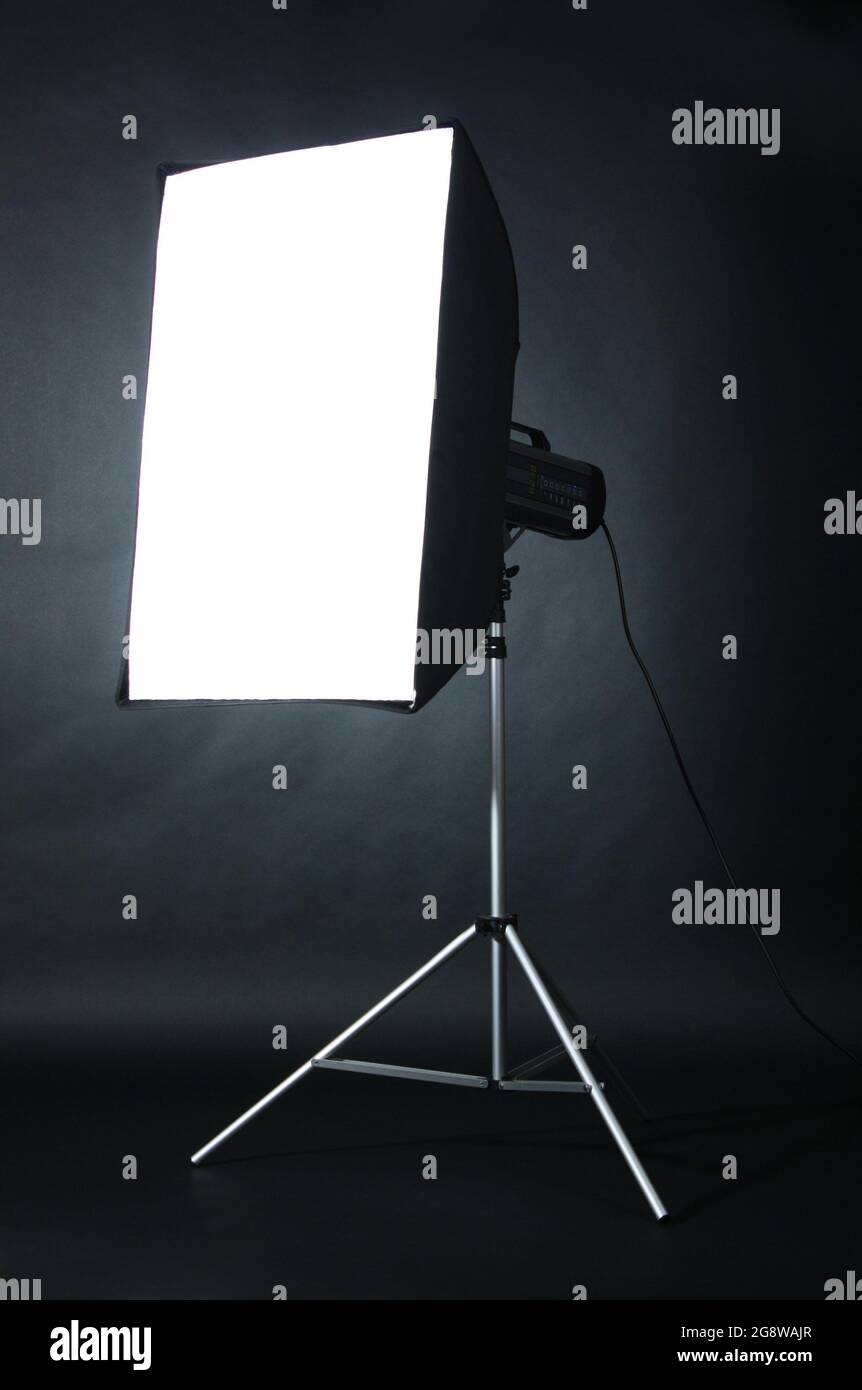 Studio flash with soft-box on black studio background Stock Photo - Alamy