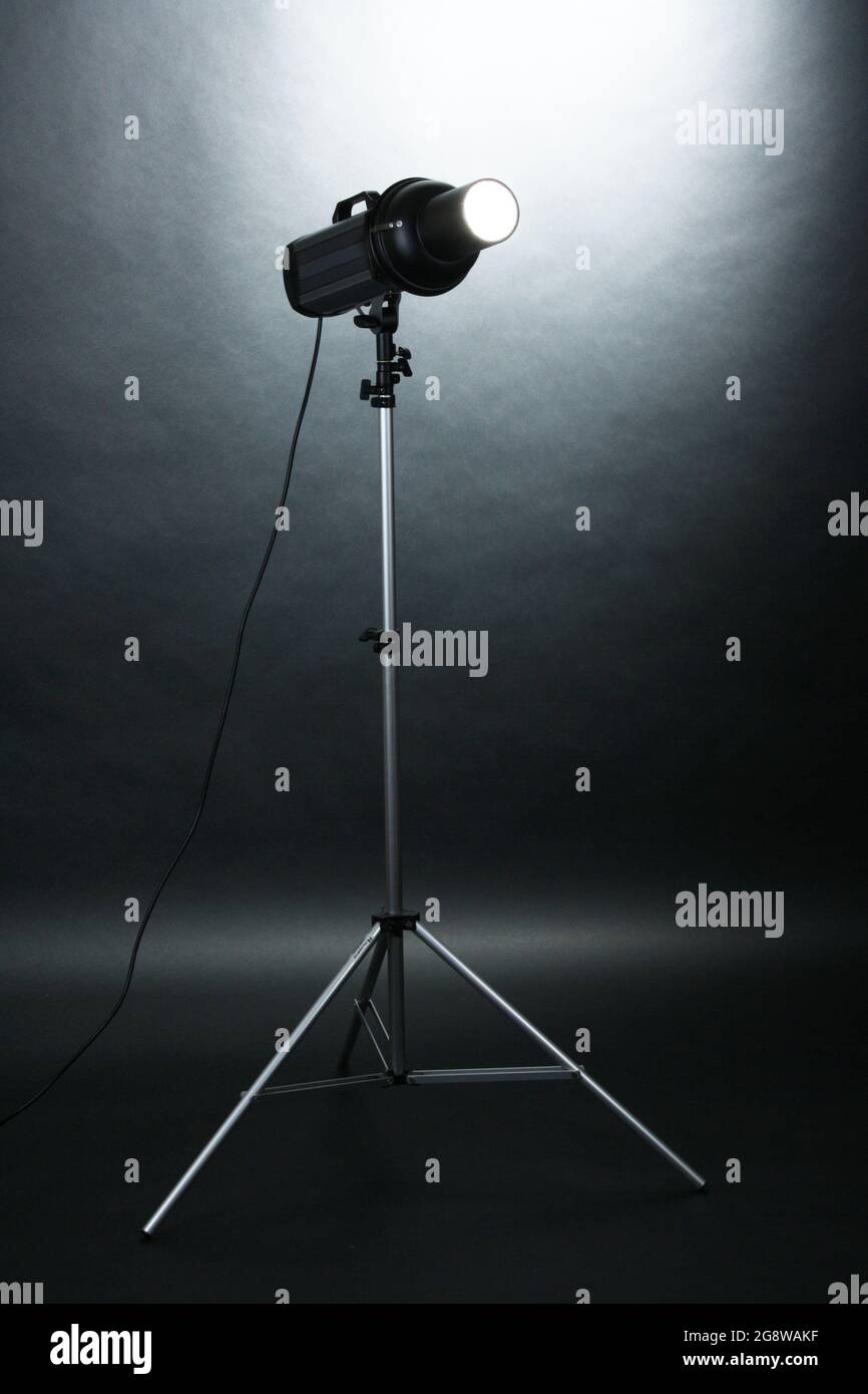 Studio flash on grey background Stock Photo - Alamy
