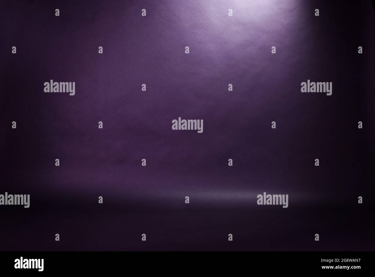 Spotlight studio interior, purple background Stock Photo - Alamy